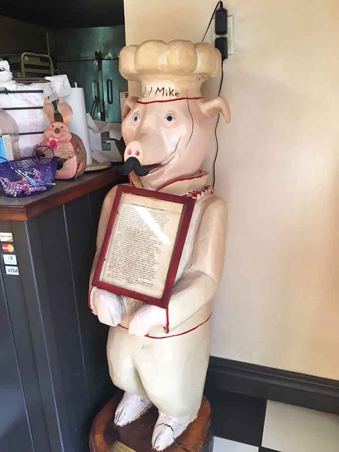 Even the pig statue knows this place is legit, standing guard over recipes worth protecting with pride.