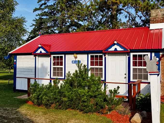 Cozy cabins painted to match the store, creating a whole patriotic village by the lake.