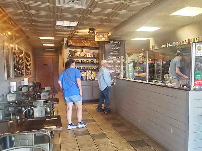 Friendly faces work the open kitchen where you can watch your order come to life.