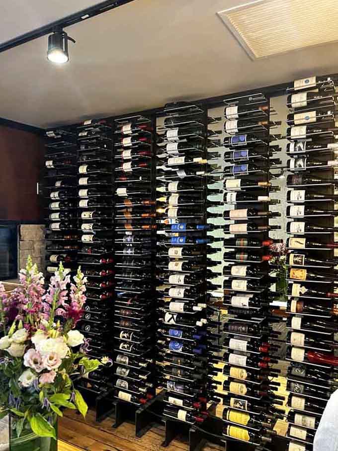 A wine wall this impressive suggests someone here takes their beverage program as seriously as their smoked meats.