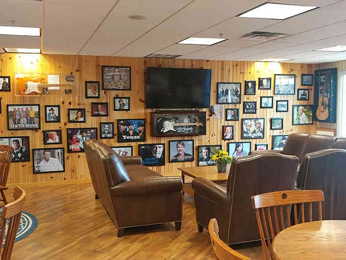 A wall of country music legends watches over diners like the Mount Rushmore of good taste and great tunes.