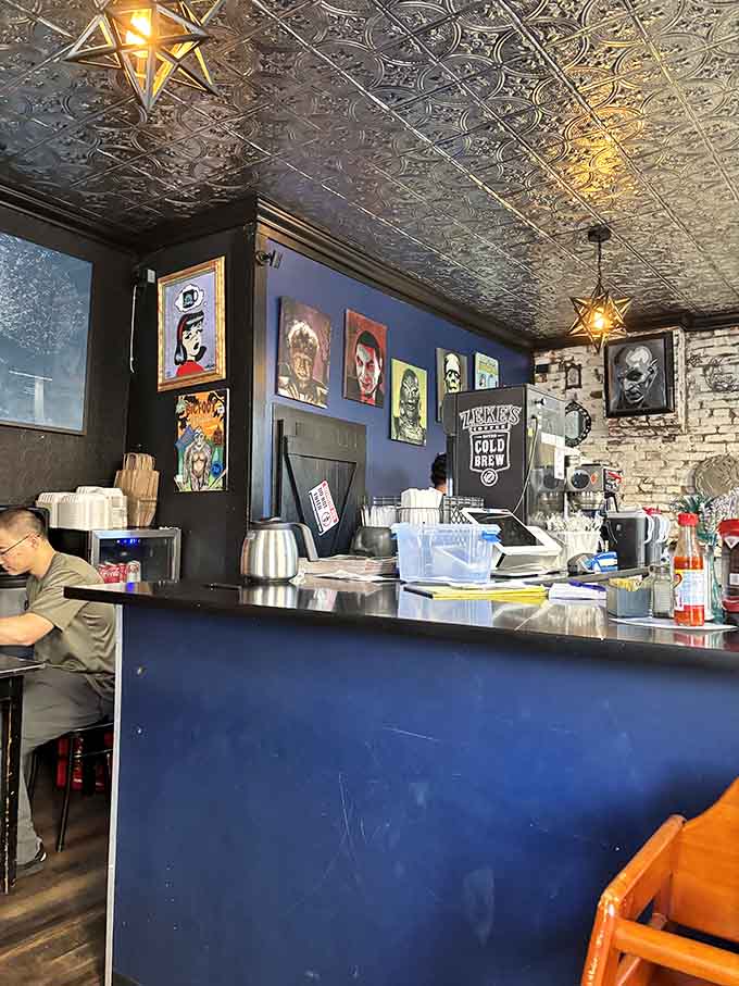 Behind that blue counter, magic happens daily as orders fly and breakfast dreams become delicious reality for hungry patrons.