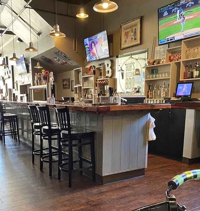 The bar area gleams with promise, offering cold beverages to pair perfectly with all that glorious smoked meat.