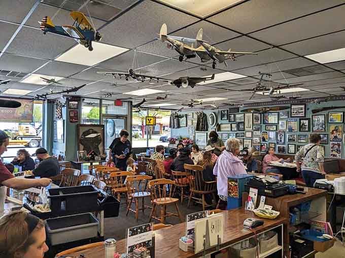 Model aircraft overhead remind you that breakfast here is always ready for takeoff into deliciousness.