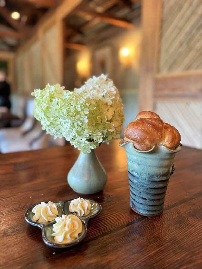 Fresh brioche stands at attention like tiny edible soldiers, ready to accompany your morning coffee on a delicious mission.