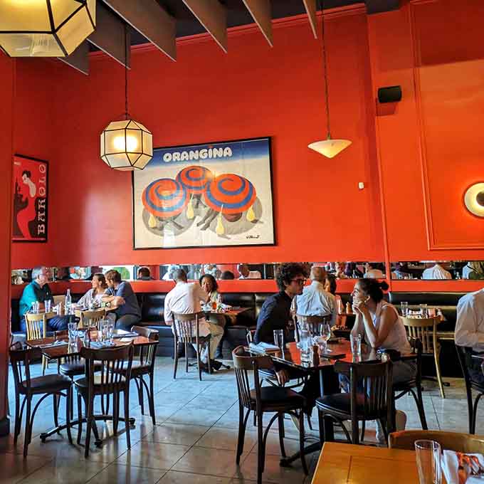 Happy diners enjoying world-class Italian cuisine in a space that feels both elegant and comfortably approachable.