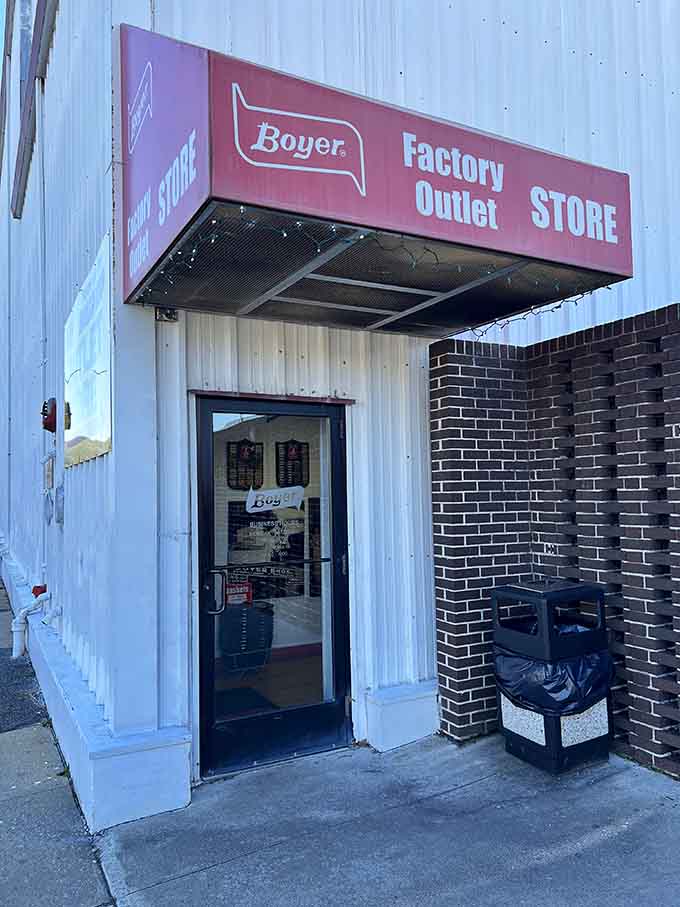 The factory outlet entrance beckons like a portal to chocolate paradise, where calories mysteriously don't count.