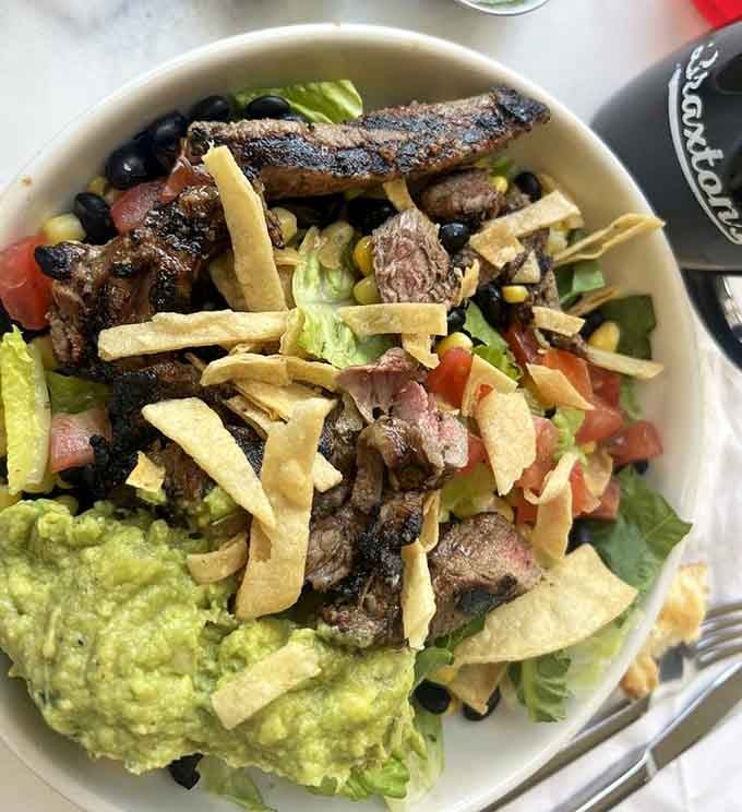 Grilled steak strips nestle into this power bowl like they've found their forever home.