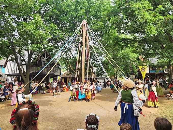 The maypole dance draws participants into swirling ribbons of color, an ancient tradition still captivating modern crowds today.