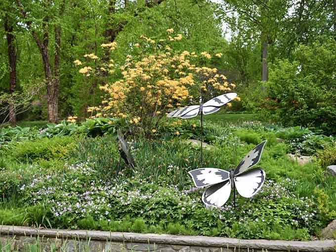 Metal butterflies prove that even garden art knows where the good flowers hang out around here.