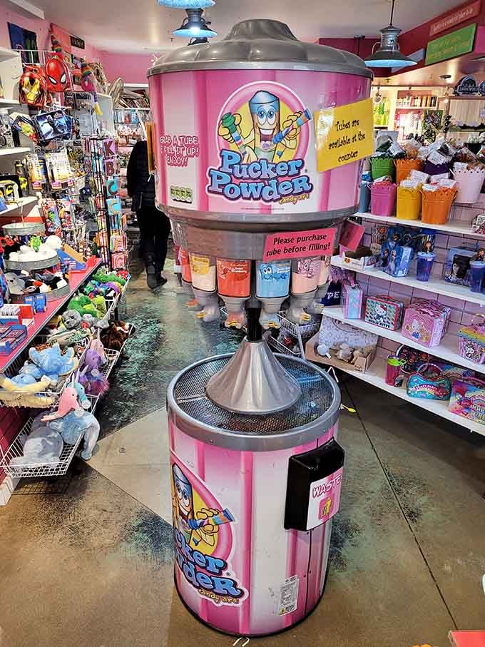 Pucker Powder's towering dispenser dominates the floor like a sweet-and-sour skyscraper of childhood joy.