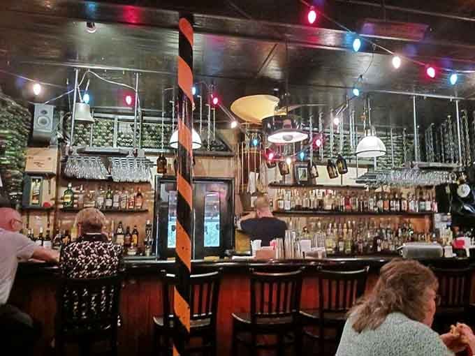 The bar glows with possibility, where every bottle tells a story and every pour starts a new conversation.