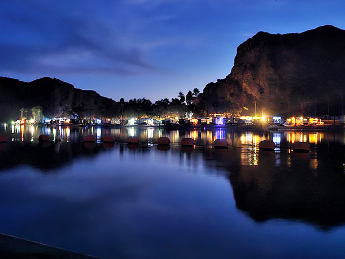 When the sun sets and campsite lights twinkle across the water like fireflies, magic happens in ways no resort can replicate.