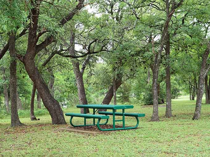Shaded picnic tables under ancient oaks create the kind of lunch spot that makes you forget about air conditioning.