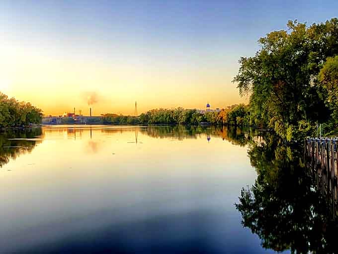 Golden hour turns the river into liquid gold, making the whole scene look like a Bob Ross painting.