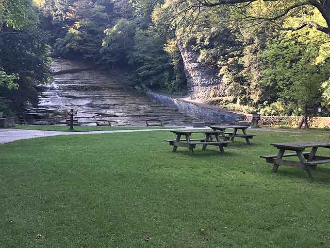 Picnic tables positioned near the falls offer front-row seats to nature's show, no ticket scalpers required here.