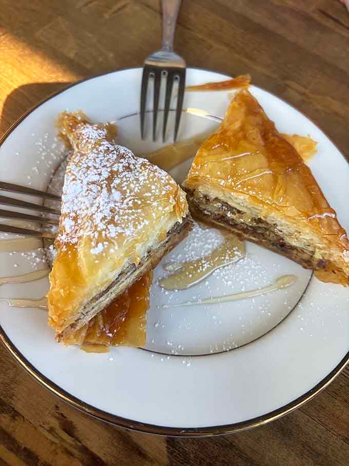 Flaky phyllo triangles dusted with powdered sugar and drizzled with honey, baklava that would make your Greek grandmother nod approvingly.