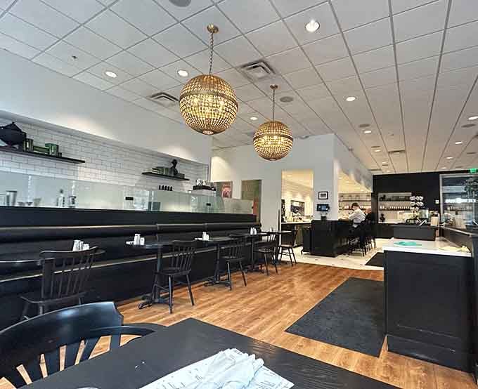 Sphere chandeliers and booth seating create an atmosphere where business meetings and lazy brunches coexist in perfect downtown harmony.