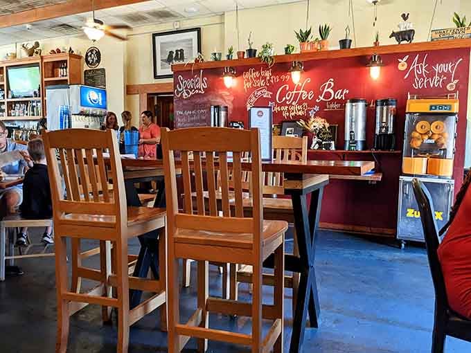 Colorful art on yellow walls creates the kind of quirky atmosphere where great meals become even better.