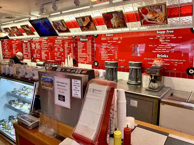 That red wall menu stretches on like a delicious novel you'll want to read cover to cover.