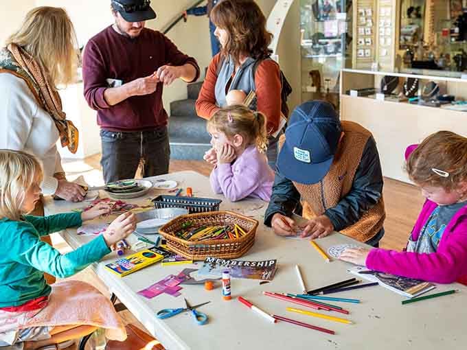 Families create art together during hands-on workshops that connect creativity with environmental awareness.