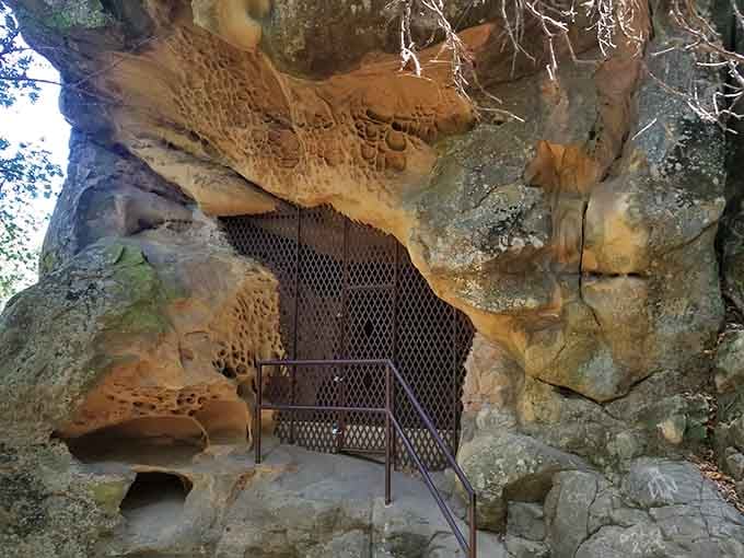 Ancient sandstone caves hold Chumash paintings behind protective gates, preserving stories older than California itself remembers.