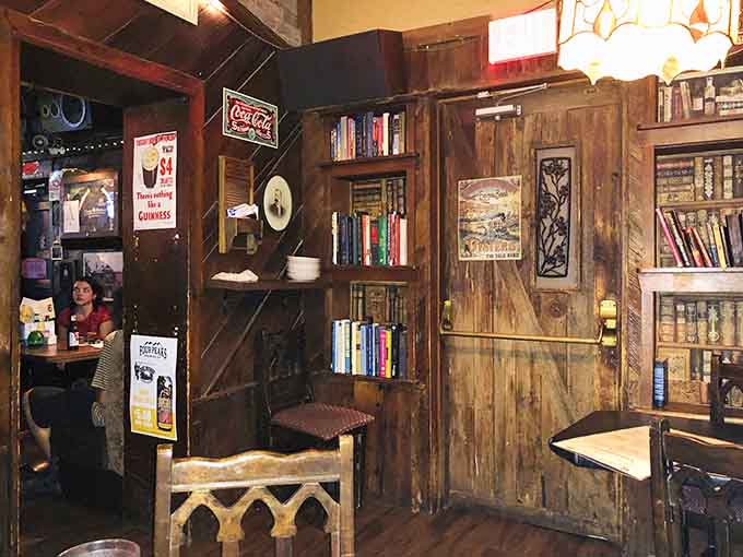 Vintage Coca-Cola signs and well-worn bookshelves create the kind of cozy corner where time stands still.