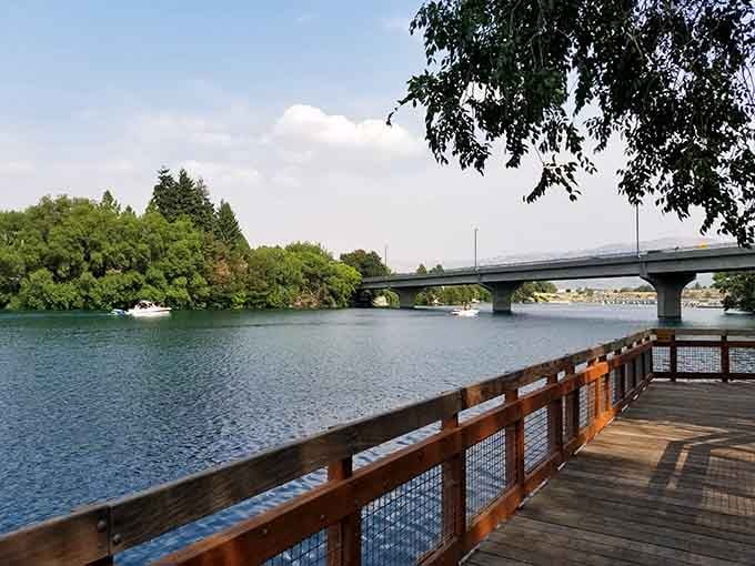 Boats dotting the distance remind you this isn't just a walking path, it's a gateway to lake life.