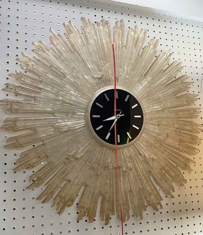 That starburst clock screams mid-century modern louder than your interior designer ever could, and costs way less.