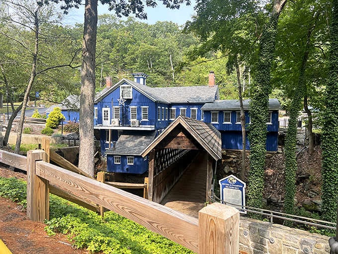 A covered bridge painted blue because sometimes Connecticut decides to add whimsy to its historic infrastructure.