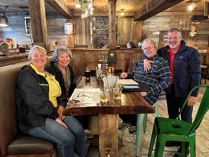 Happy diners enjoying their meal in the warm wooden interior &ndash; this is what dining out should always feel like, honestly.