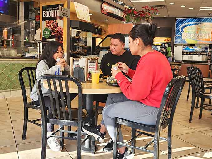 Real people enjoying real food in a real gas station: this is democracy in delicious action.