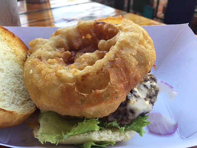 The Bronco Burger topped with an onion ring, because sometimes you need your sides riding directly on top.