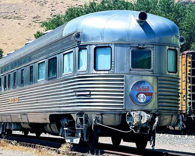 The sleek observation car gleams like a silver bullet, ready to whisk passengers through mountain scenery.