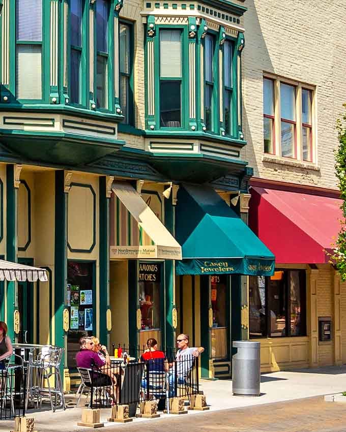 Colorful storefronts and outdoor seating create the kind of streetscape that makes you slow down naturally.