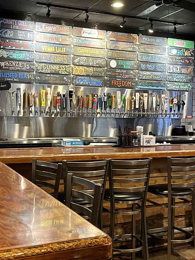 A bar backed by dozens of taps and colorful chalkboard signs, where the beer selection rivals the meat menu.