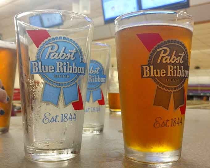 Cold beverages await in classic glassware, perfect for celebrating strikes or consoling yourself after gutter balls.