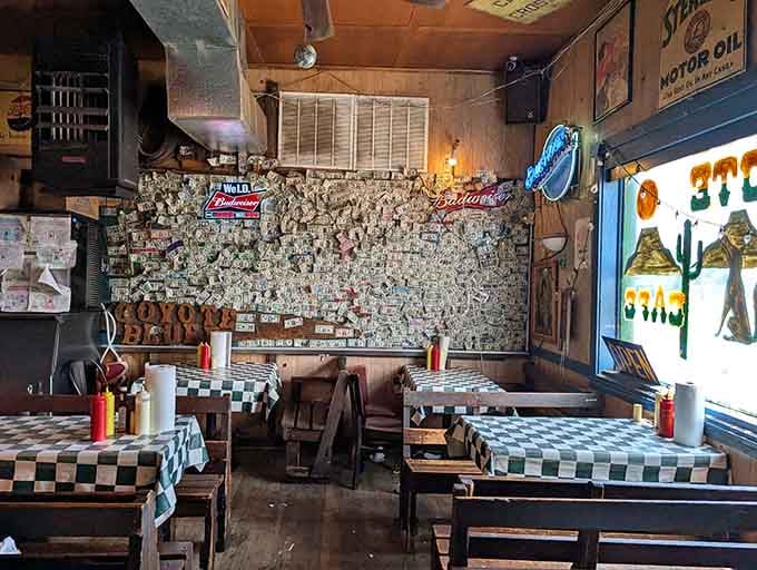The interior's dollar-covered walls and vintage signs create an atmosphere money literally can't buy, though people keep trying.
