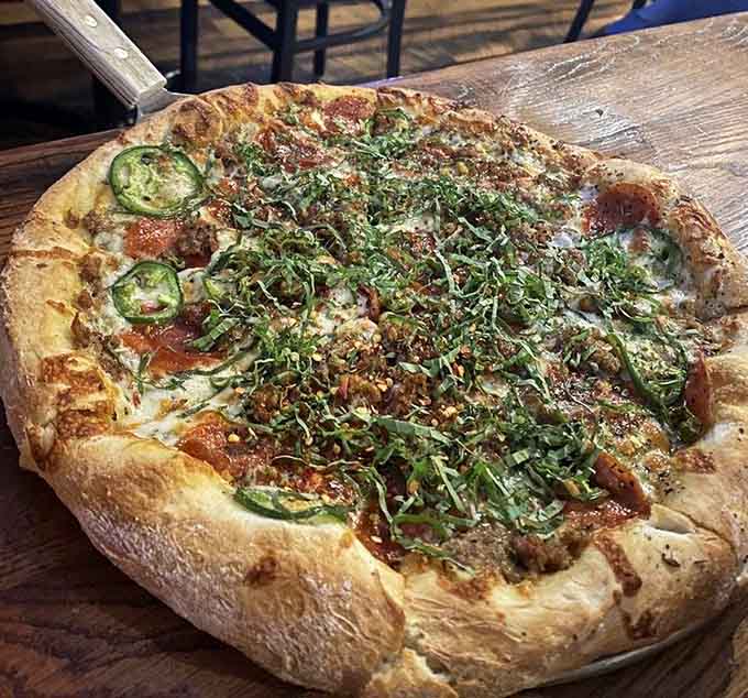 Jalape&ntilde;os and fresh greens on a beautifully charred pie that brings the heat without overwhelming your taste buds.