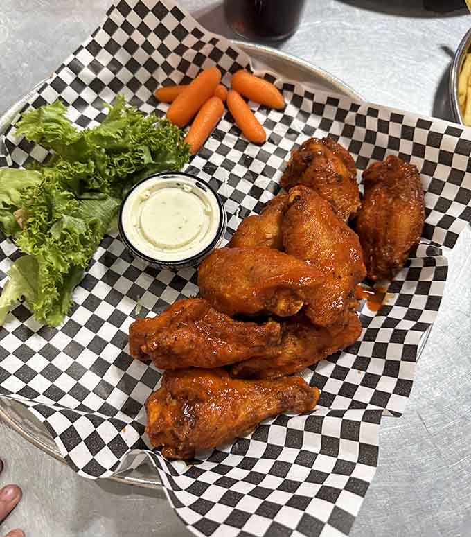 Wings glazed to perfection, served with carrots that are clearly just there to make you feel better.