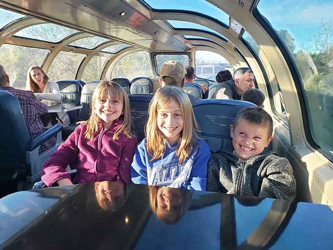 Young riders beam with excitement, proving that trains still captivate kids despite the existence of tablets and video games.