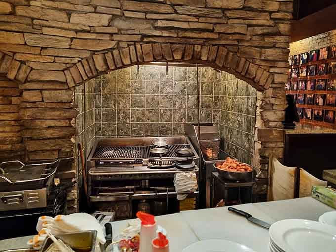 The brick oven kitchen where pizza magic happens, flames dancing and dough transforming into crispy, bubbly perfection.