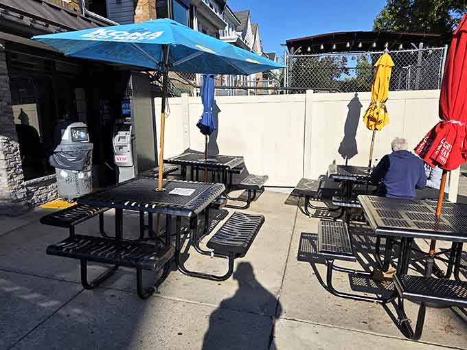 The outdoor seating area with colorful umbrellas offers the perfect spot to devour your sandwich in the fresh air.