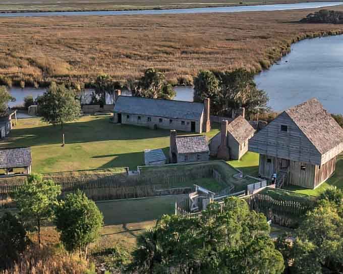 Fort King George's buildings stand as reminders that colonial life was basically camping with worse food options.