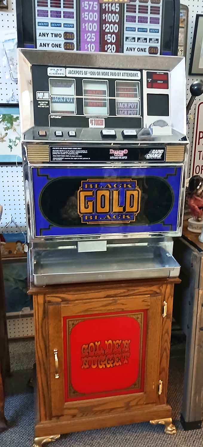 A vintage slot machine stands ready to dispense nostalgia instead of quarters, its Black Gold promise still gleaming brightly.