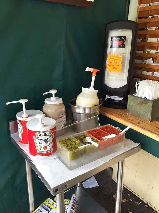 The condiment station where ketchup, mustard, and relish wait patiently to make your hot dog dreams come true.