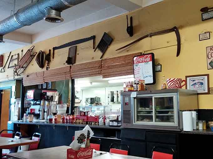 The open kitchen and vintage tools on the wall tell you this place has nothing to hide.