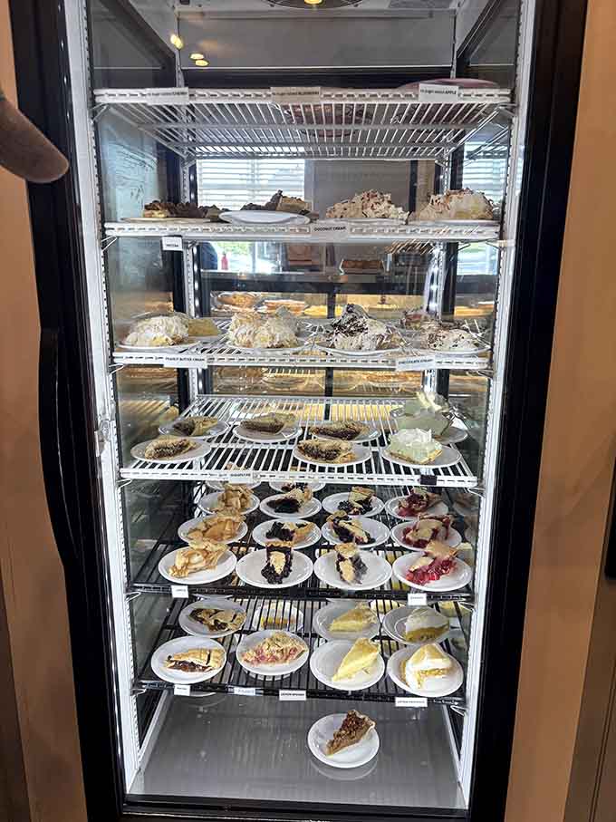 A refrigerated case packed with homemade pies: this is what heaven's dessert section probably looks like.