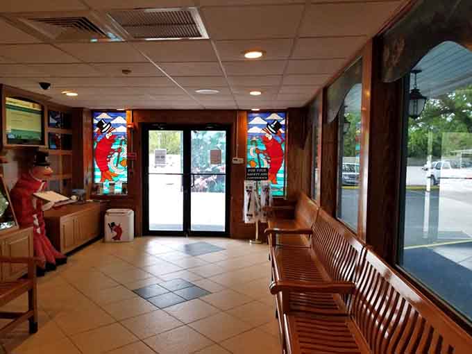 Colorful stained glass shrimp flanking the entrance, setting the tone before you even sit down to your first dozen.