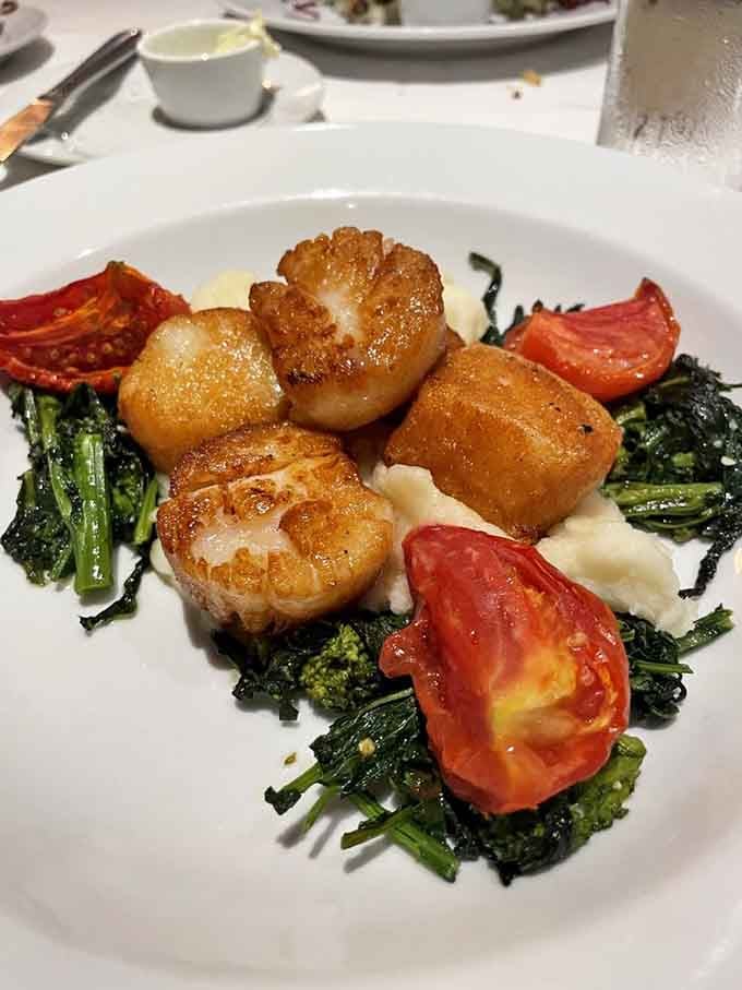 Seared scallops achieving that perfect golden crust while remaining tender inside&mdash;basically showing off at this point, honestly.